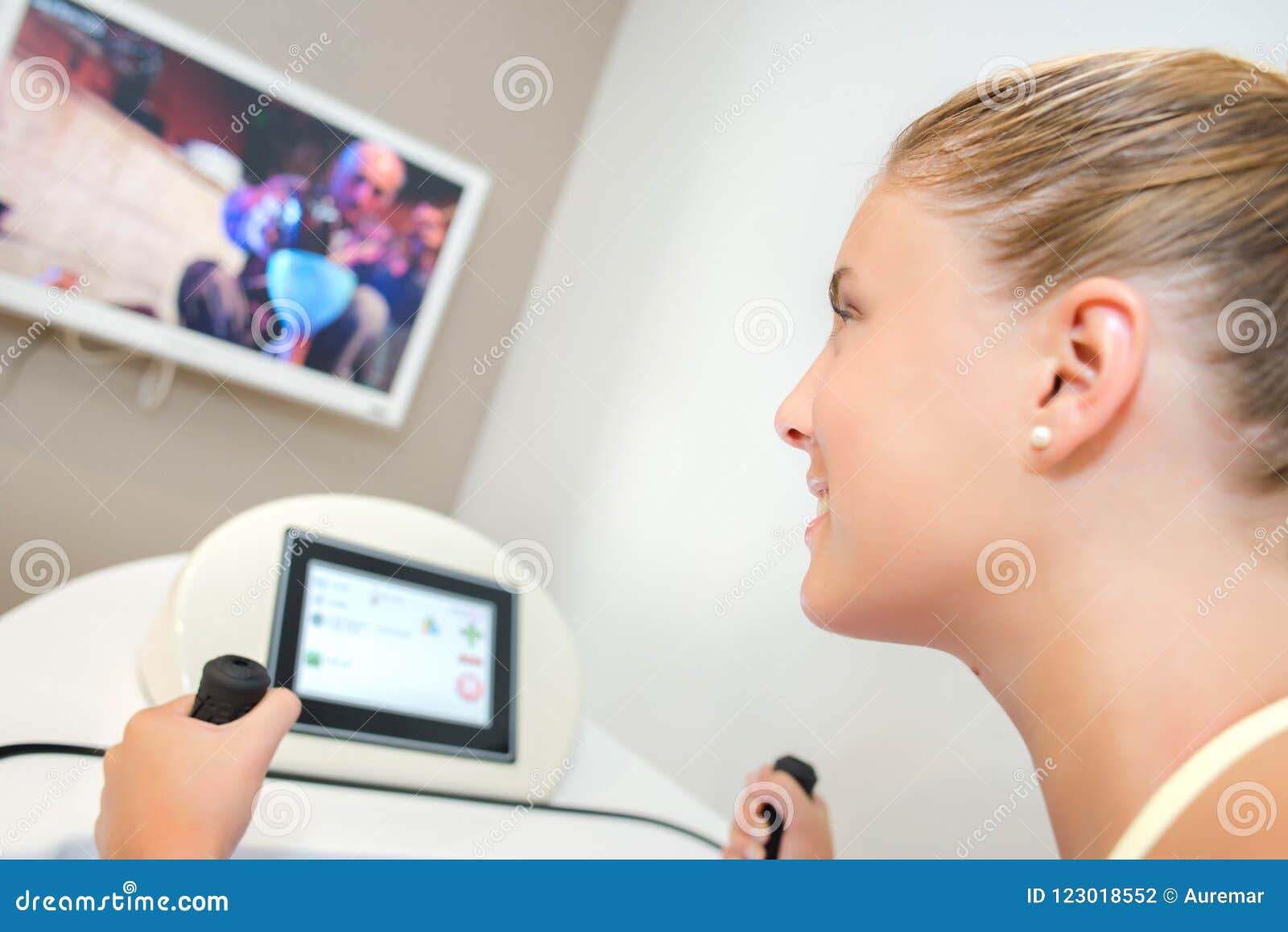 Lady on Exercise Machine Watching TV Screen Stock Photo - Image of ...