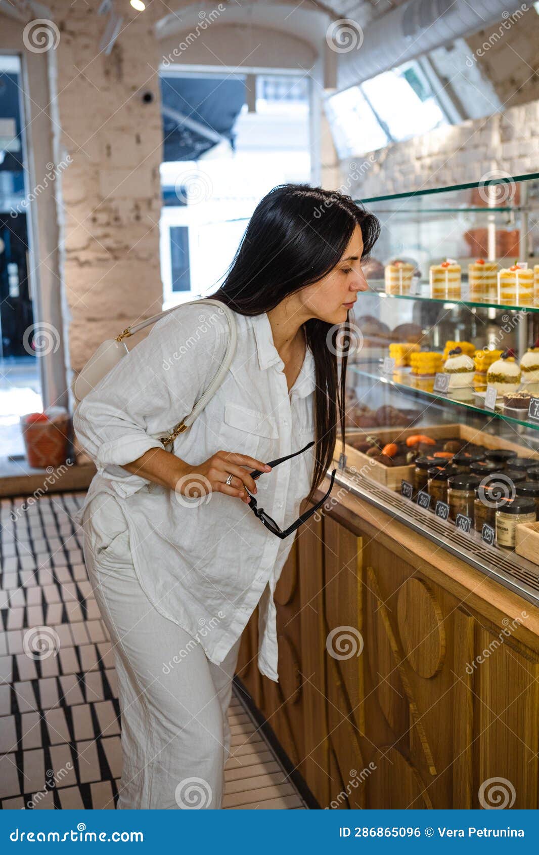 Lady Gazes at the Bakery Counter in Cafe Stock Photo - Image of ...