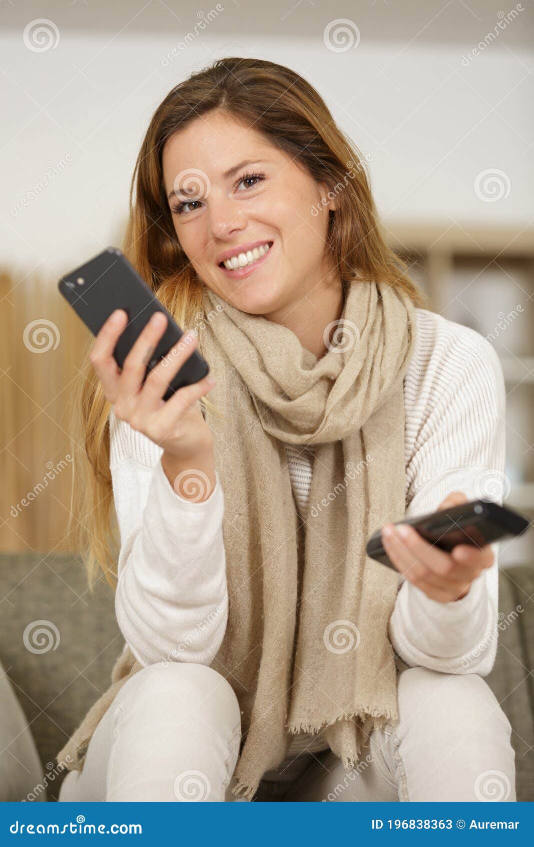 Lady Holding Smartphone and Remote Control Stock Image - Image of ...