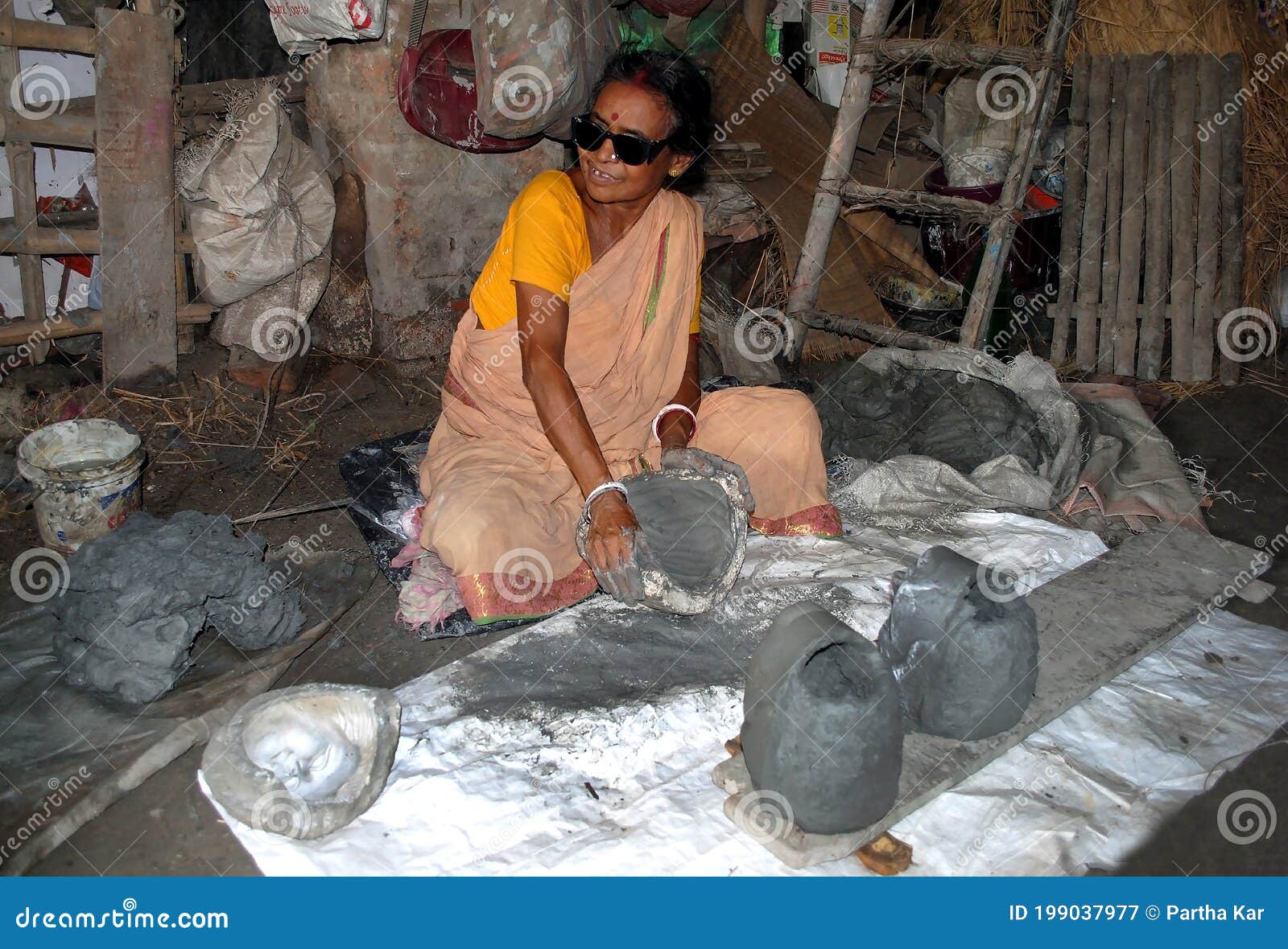 A Lady Image Maker Busy in Idol Making. Editorial Photography - Image ...