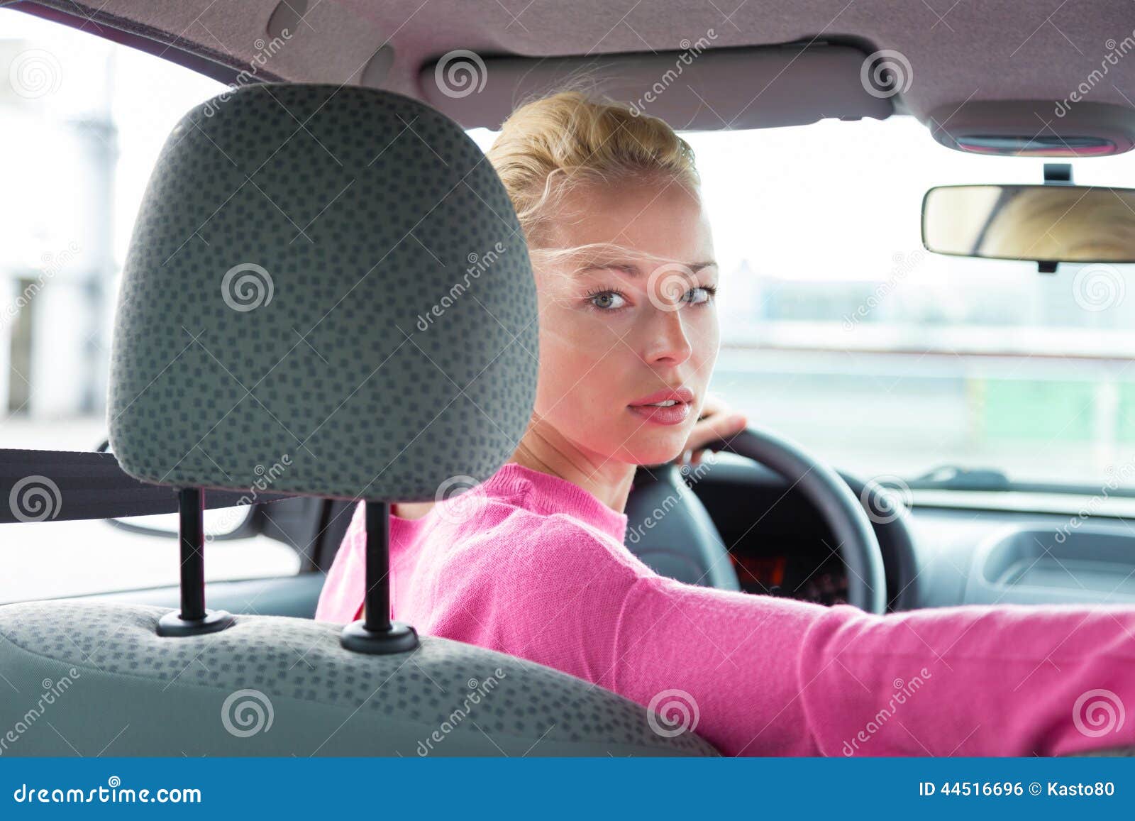 Lady Looking Back while Reversing. Stock Photo - Image of face, pink ...