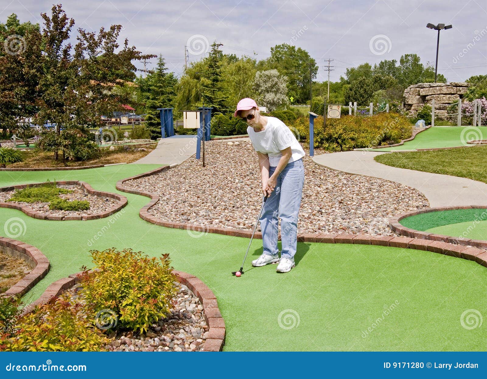 Lady at Mini Golf Course stock photo. Image of hazard - 9171280