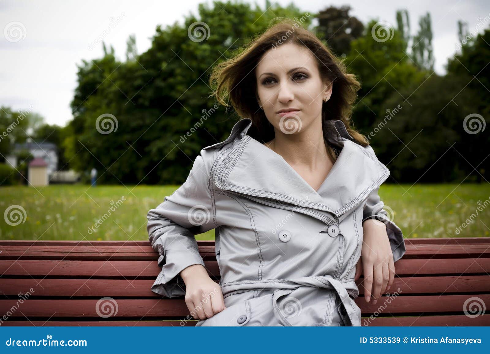 Lady in the Park stock image. Image of raincoat, adult - 5333539