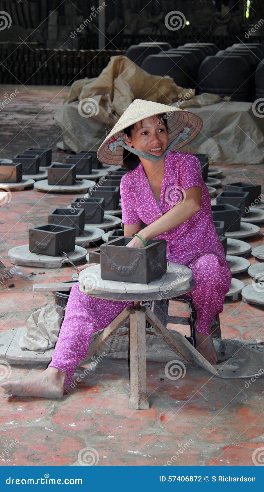 A Vietnamese Lady In Traditional Conical Hat, Sits On Her Wooden Boat ...