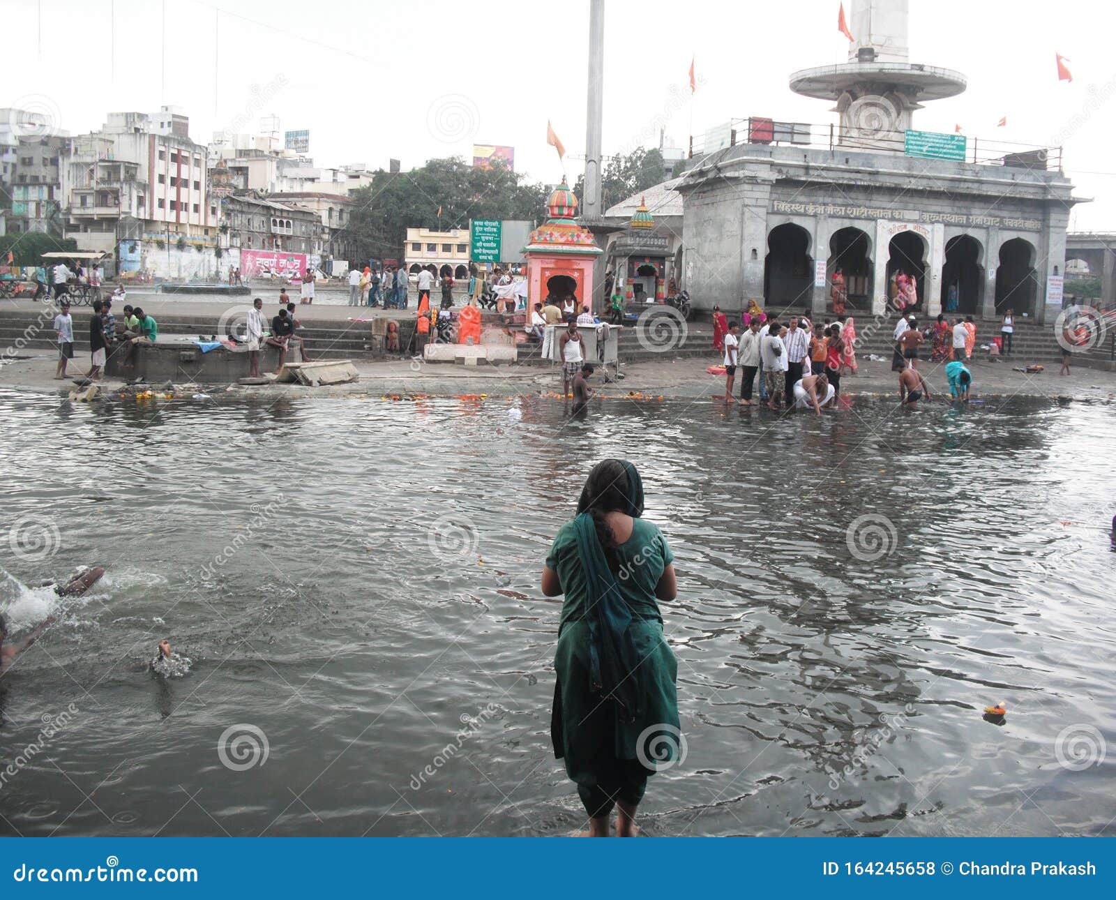 A lady praising river God editorial stock photo. Image of temple ...
