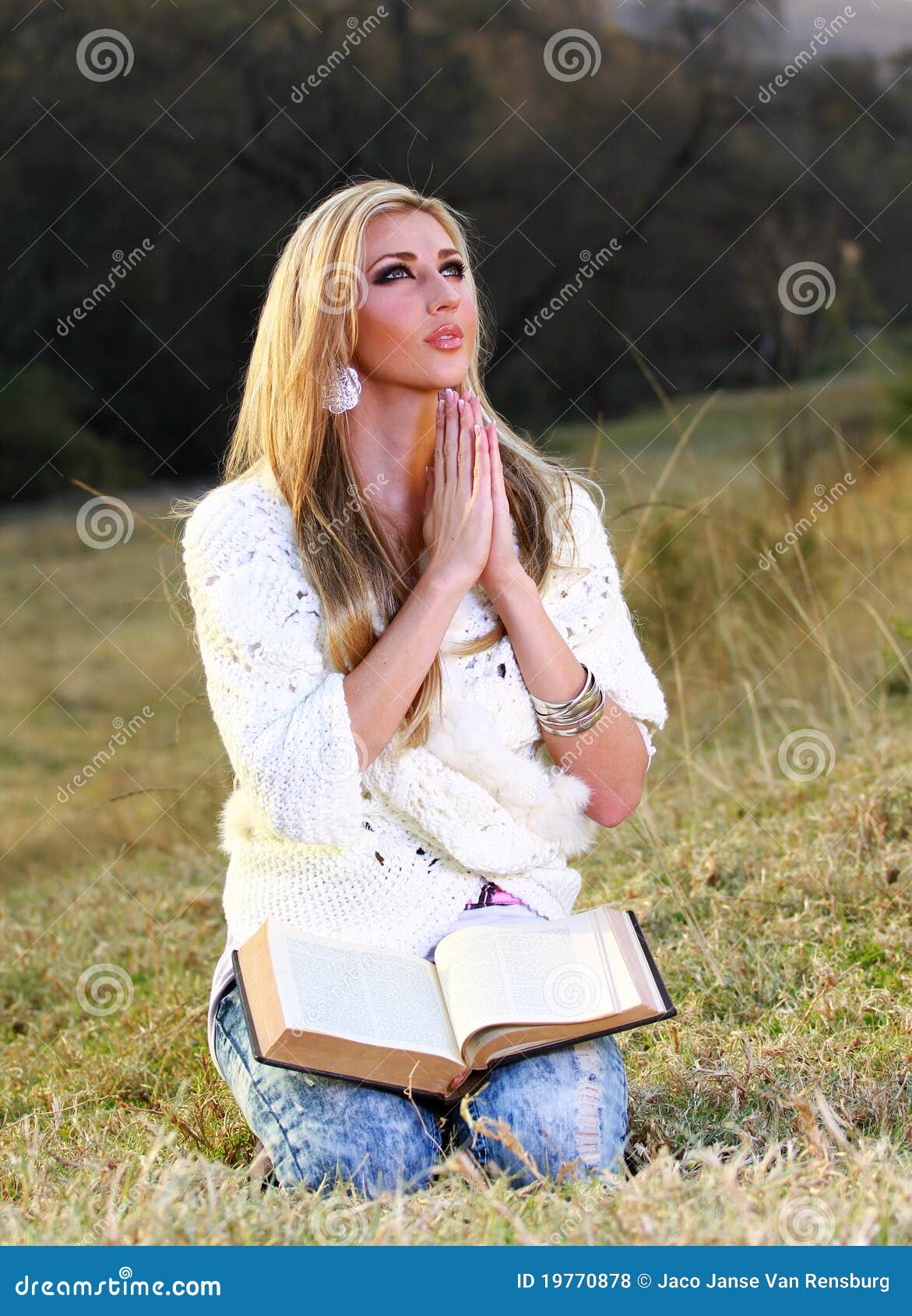 Lady praying in park stock photo. Image of young, kneel - 19770878