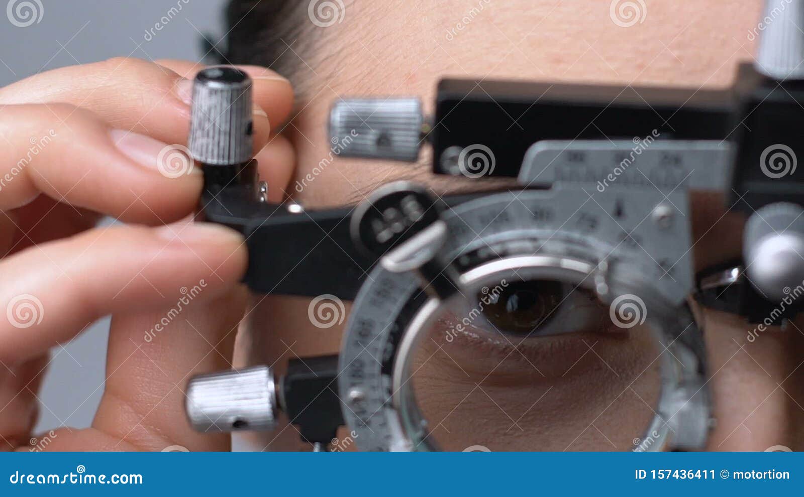 Lady Putting on Ophthalmic Testing Device for Eye Examination and Lens ...