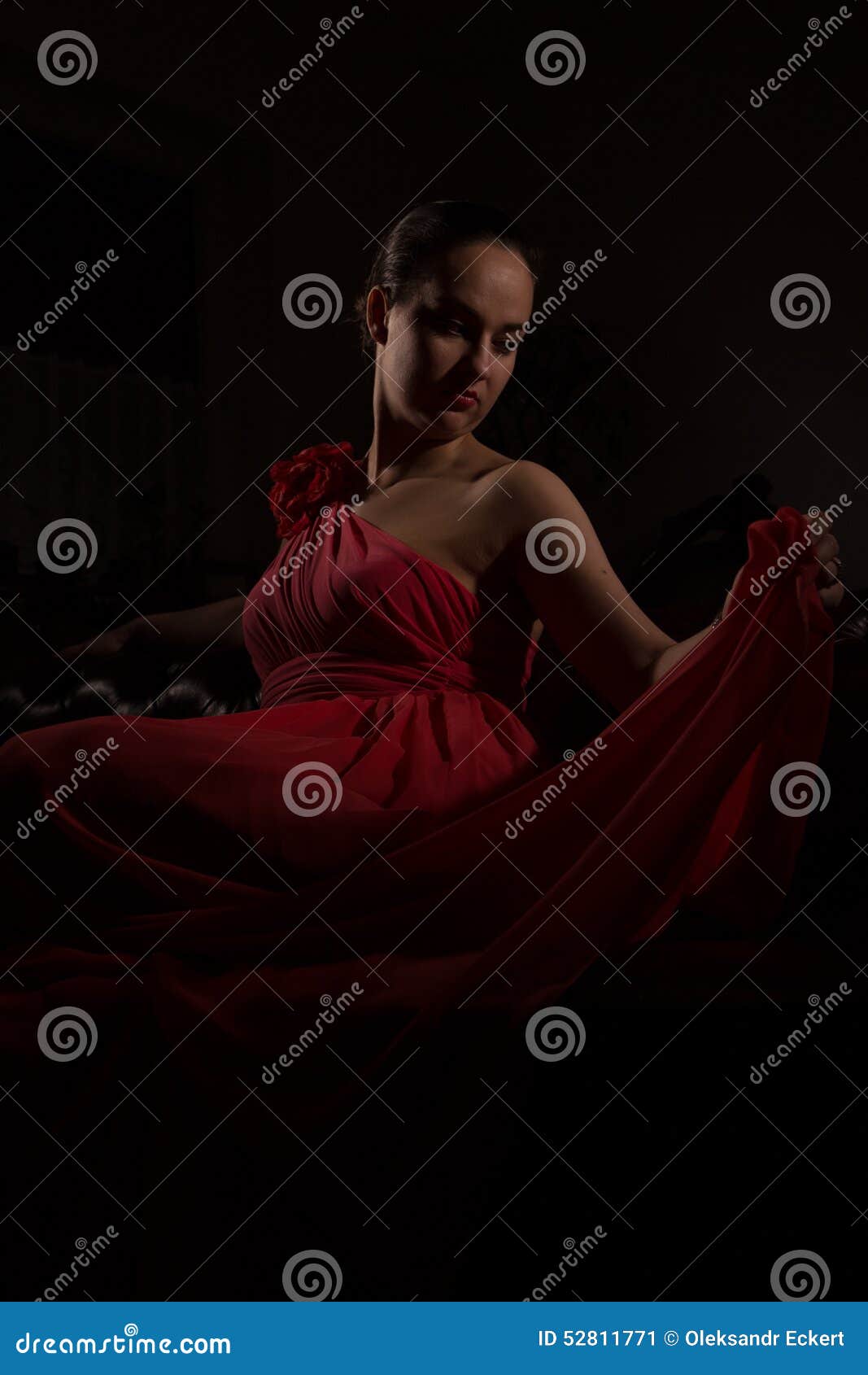 Lady in red in a dark room stock image. Image of dress - 52811771