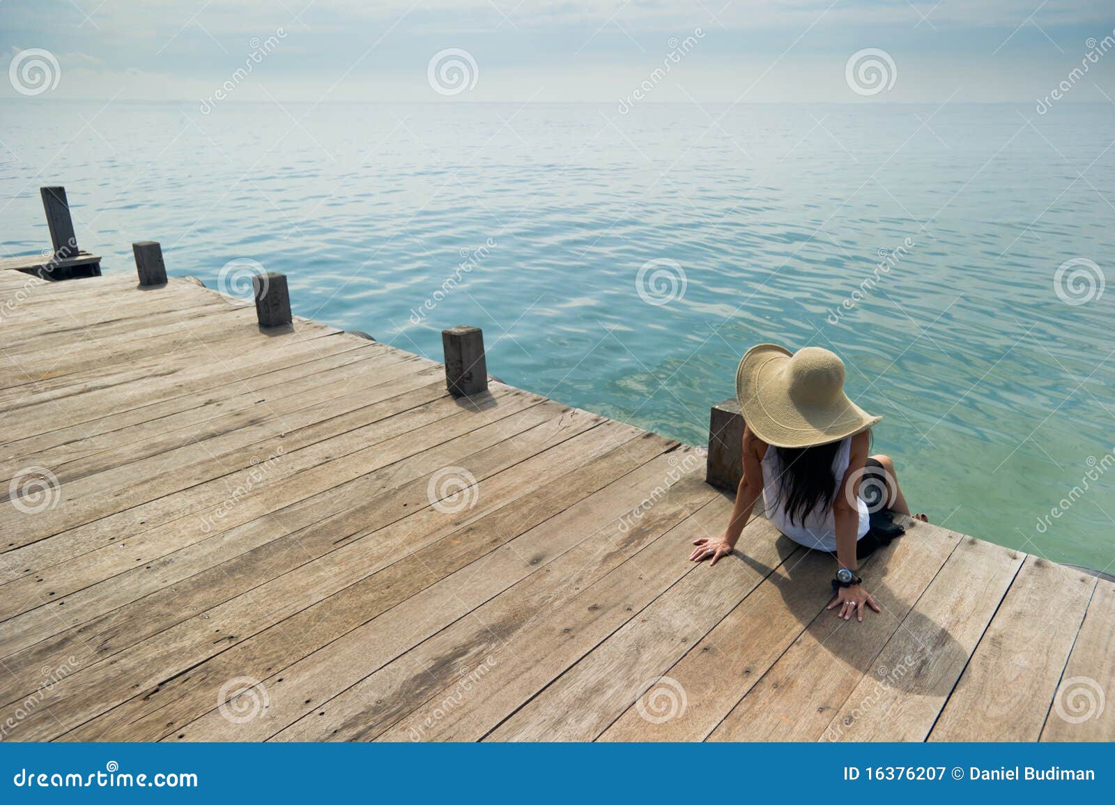 Lady relaxing at the dock stock image. Image of lonely - 16376207