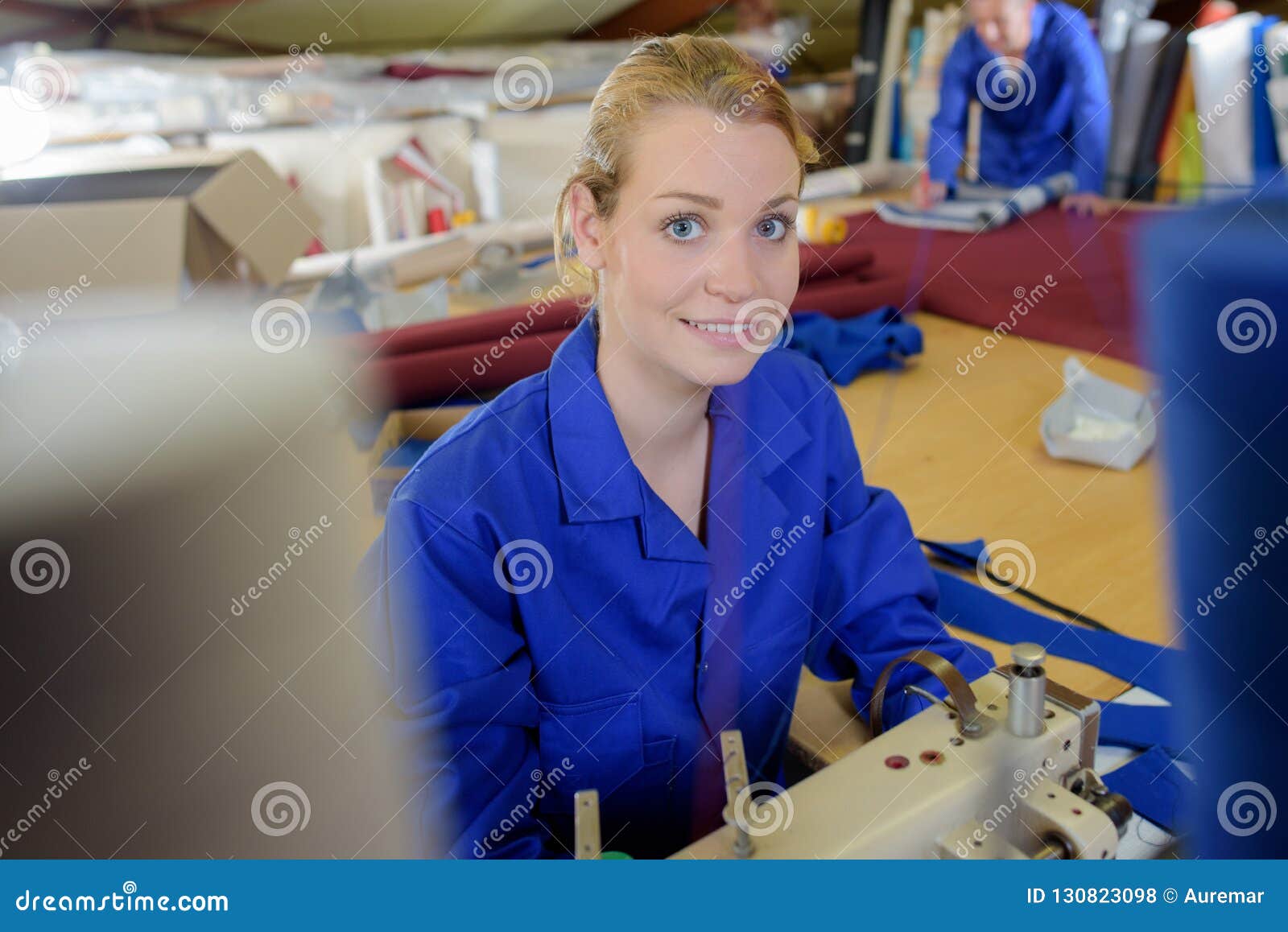 Lady sat at sewing machine stock photo. Image of labourer - 130823098