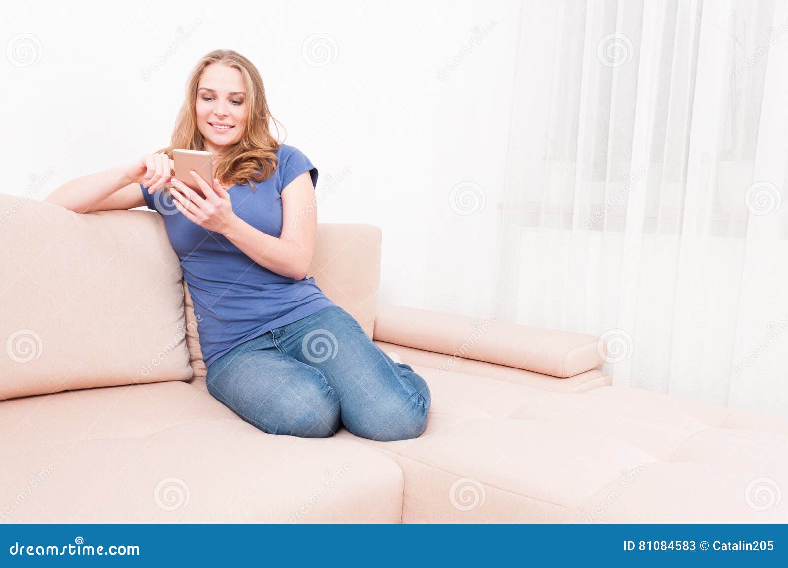 Lady Sitting On Couch Texting On Smartphone Stock Image Image Of