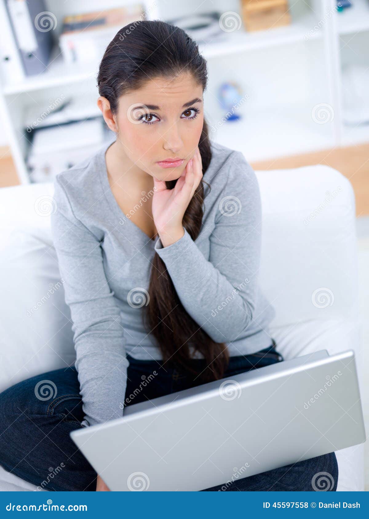 Lady Sitting on Sofa with Concerned Look Stock Photo - Image of look ...