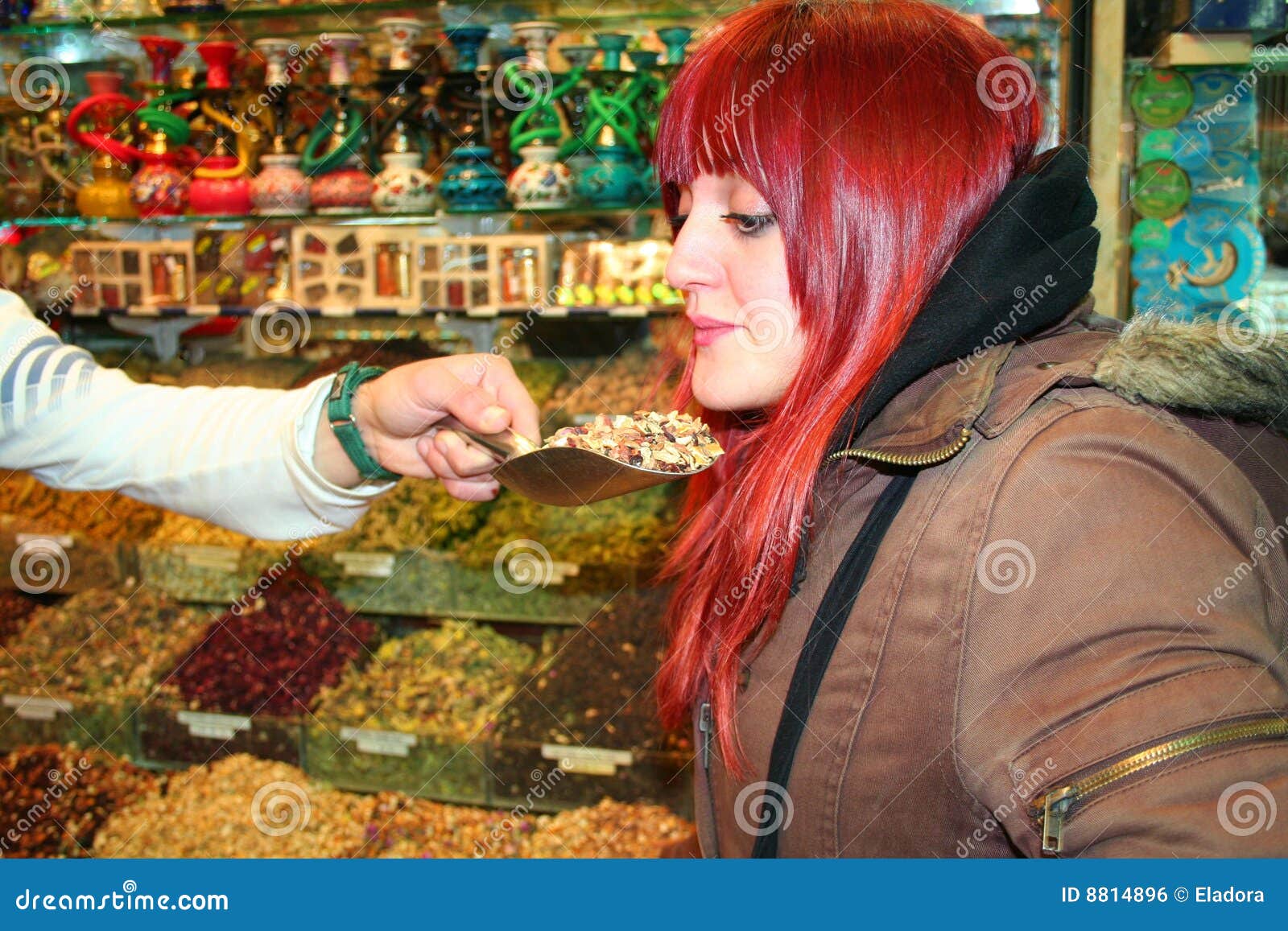 A lady smelling the spice stock photo. Image of taste - 8814896