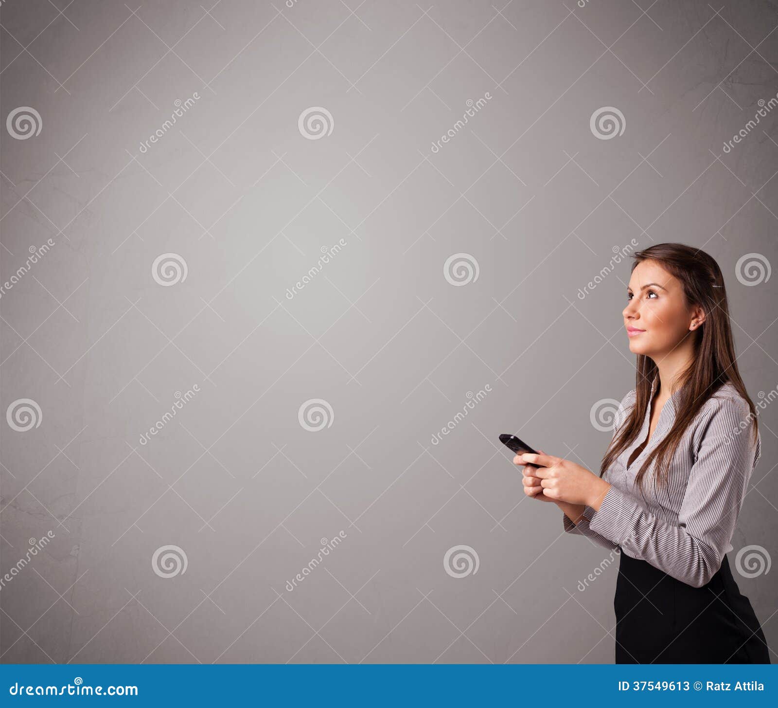Lady Standing and Holding a Phone with Copy Space Stock Image - Image ...