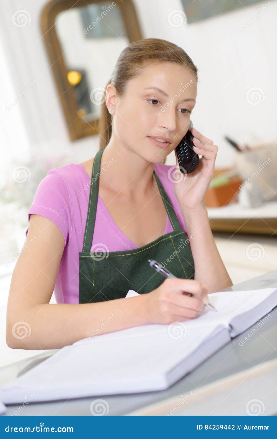Lady Taking Booking Over Phone Stock Photo - Image of desk, agenda ...