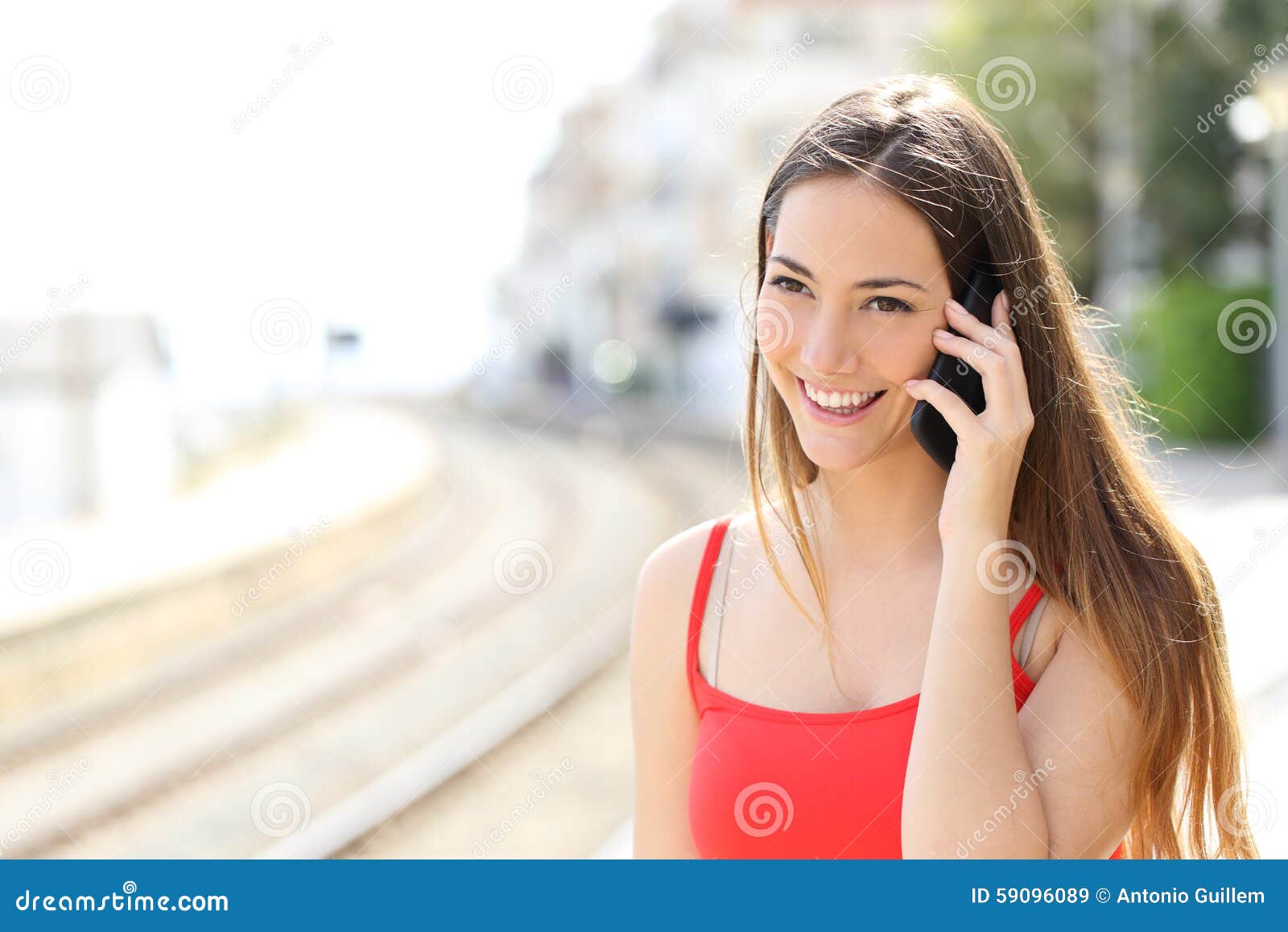 Lady Talking on the Mobile Phone in a Train Station Stock Image - Image ...