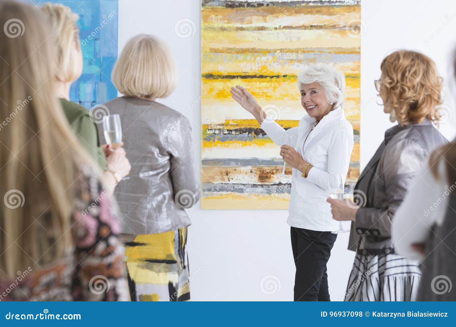 Lady Talking about Painting Stock Photo - Image of curator, gallery ...