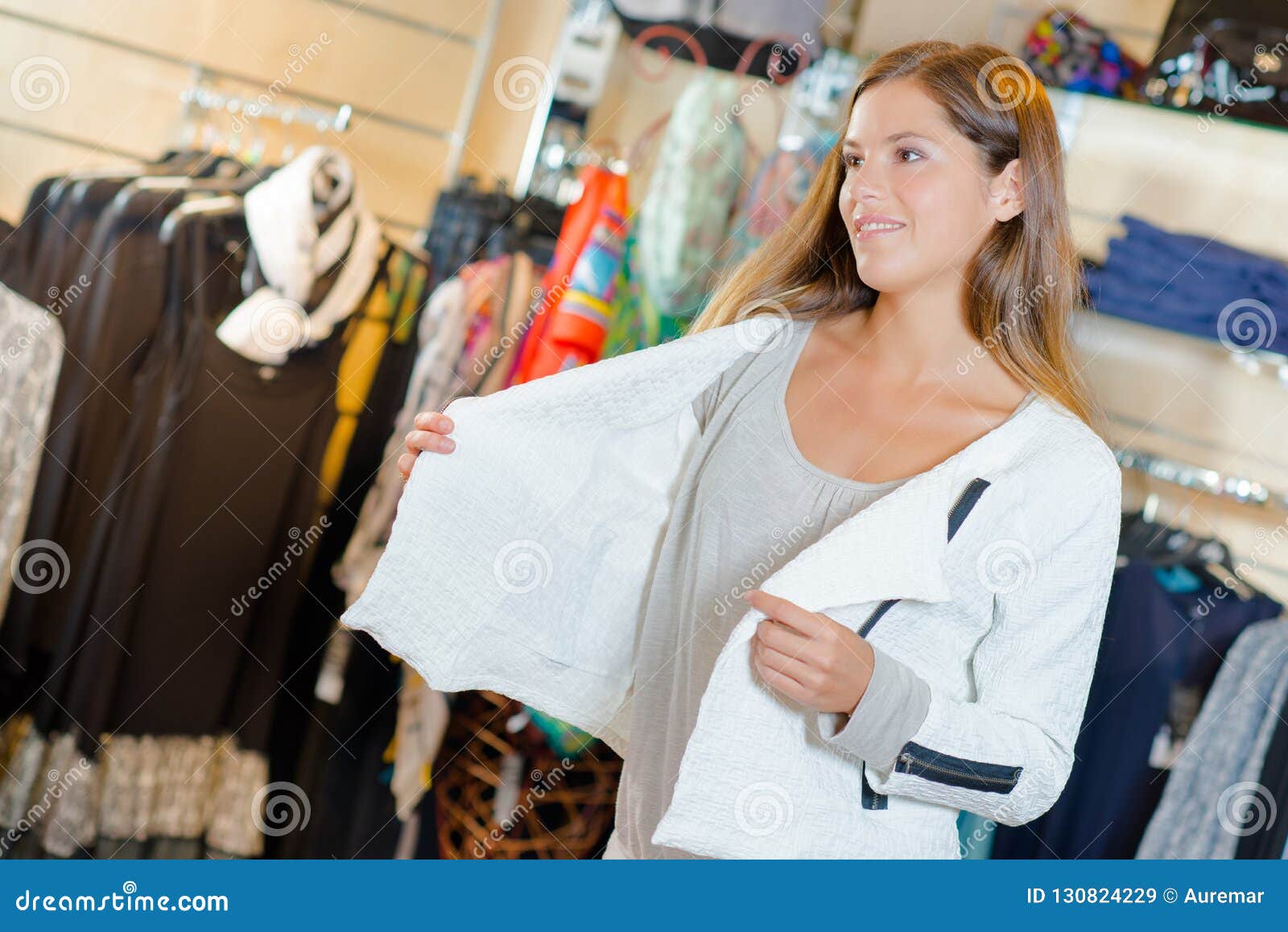 Lady Trying on Jacket in Clothes Shop Stock Image - Image of evaluate ...