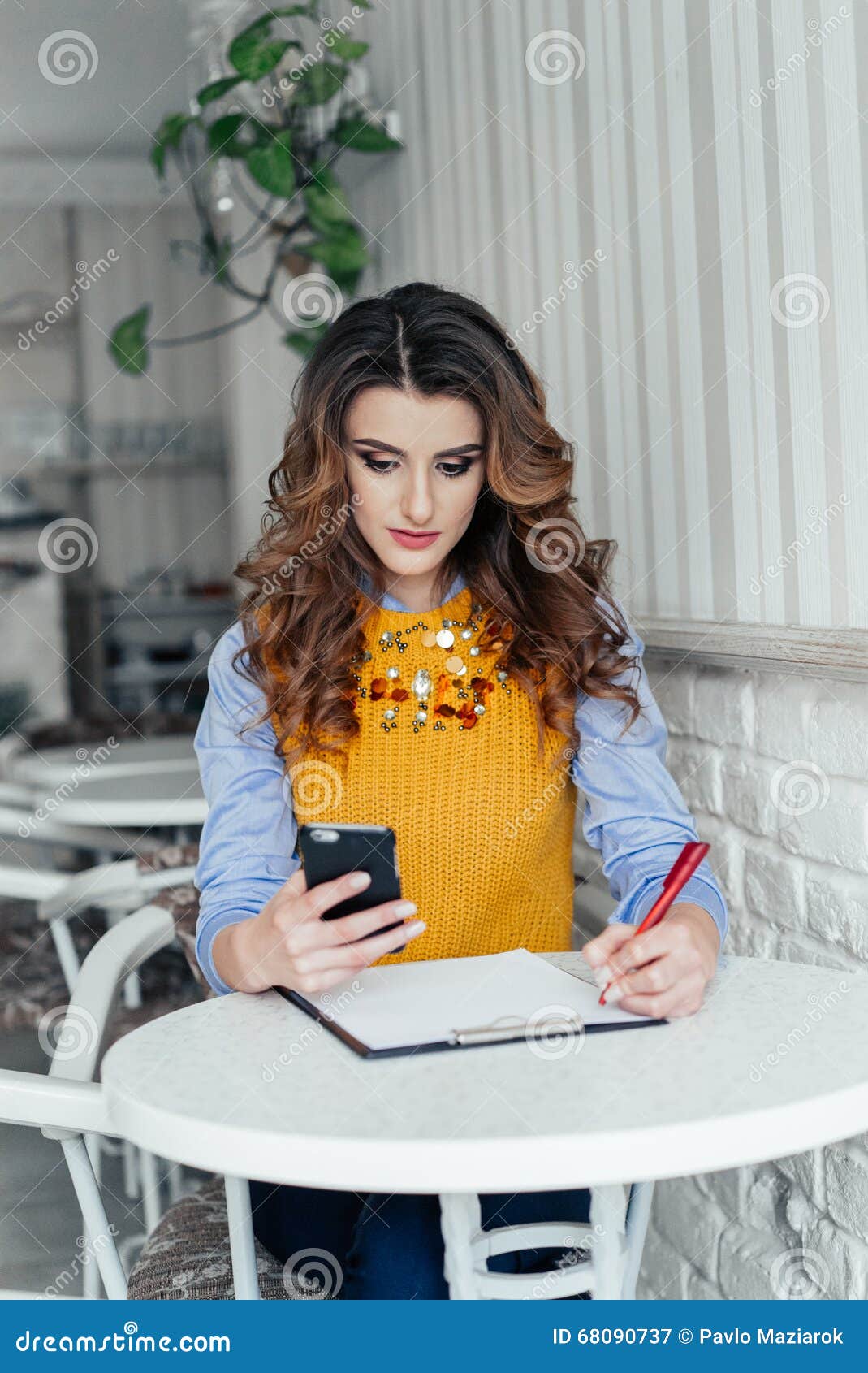 Lady using phone in a cafe stock image. Image of ideas - 68090737
