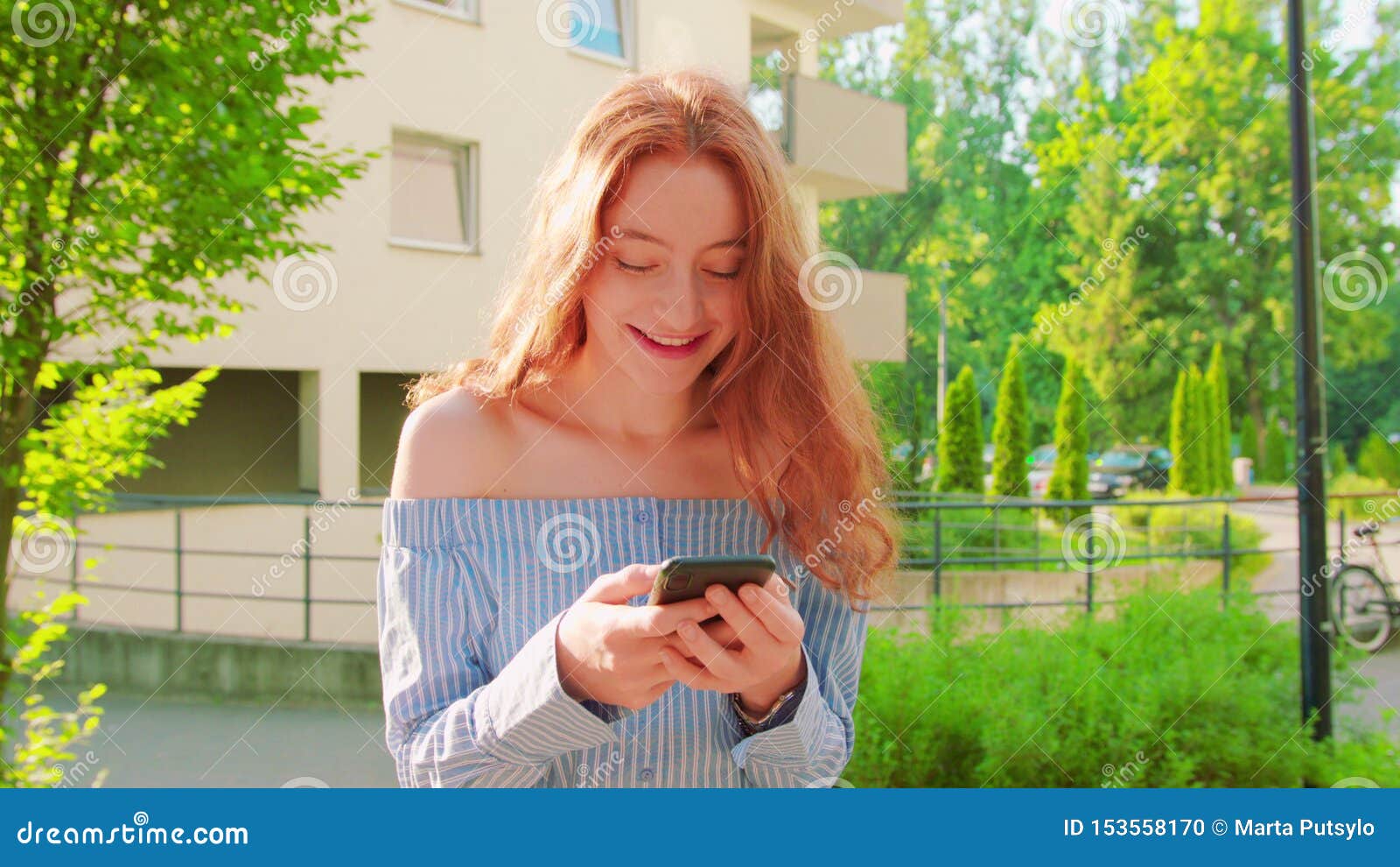 Lady Using a Phone Outdoors Stock Photo - Image of hand, internet ...