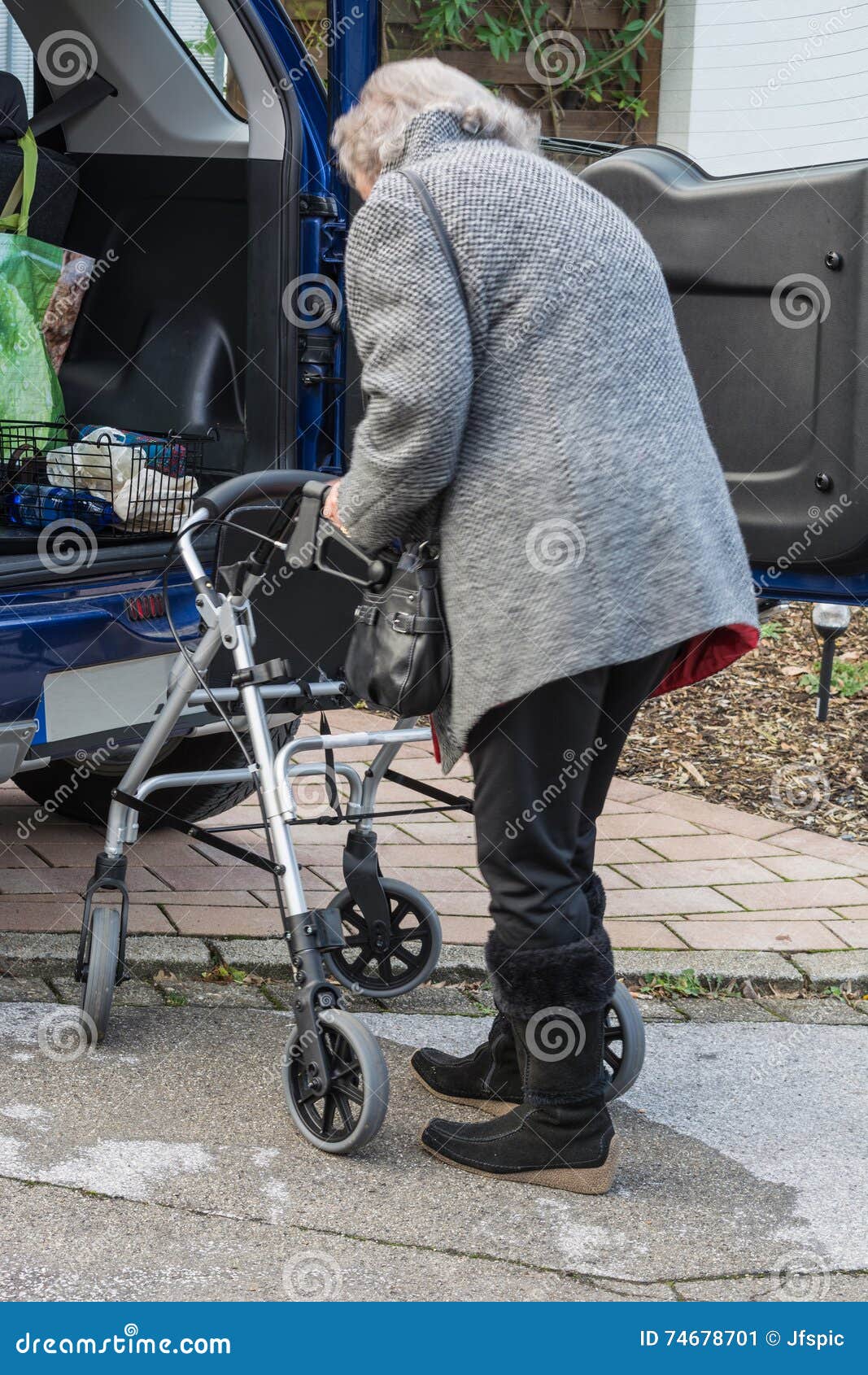 Lady with a Walker in Front of a Car. Stock Image - Image of black ...
