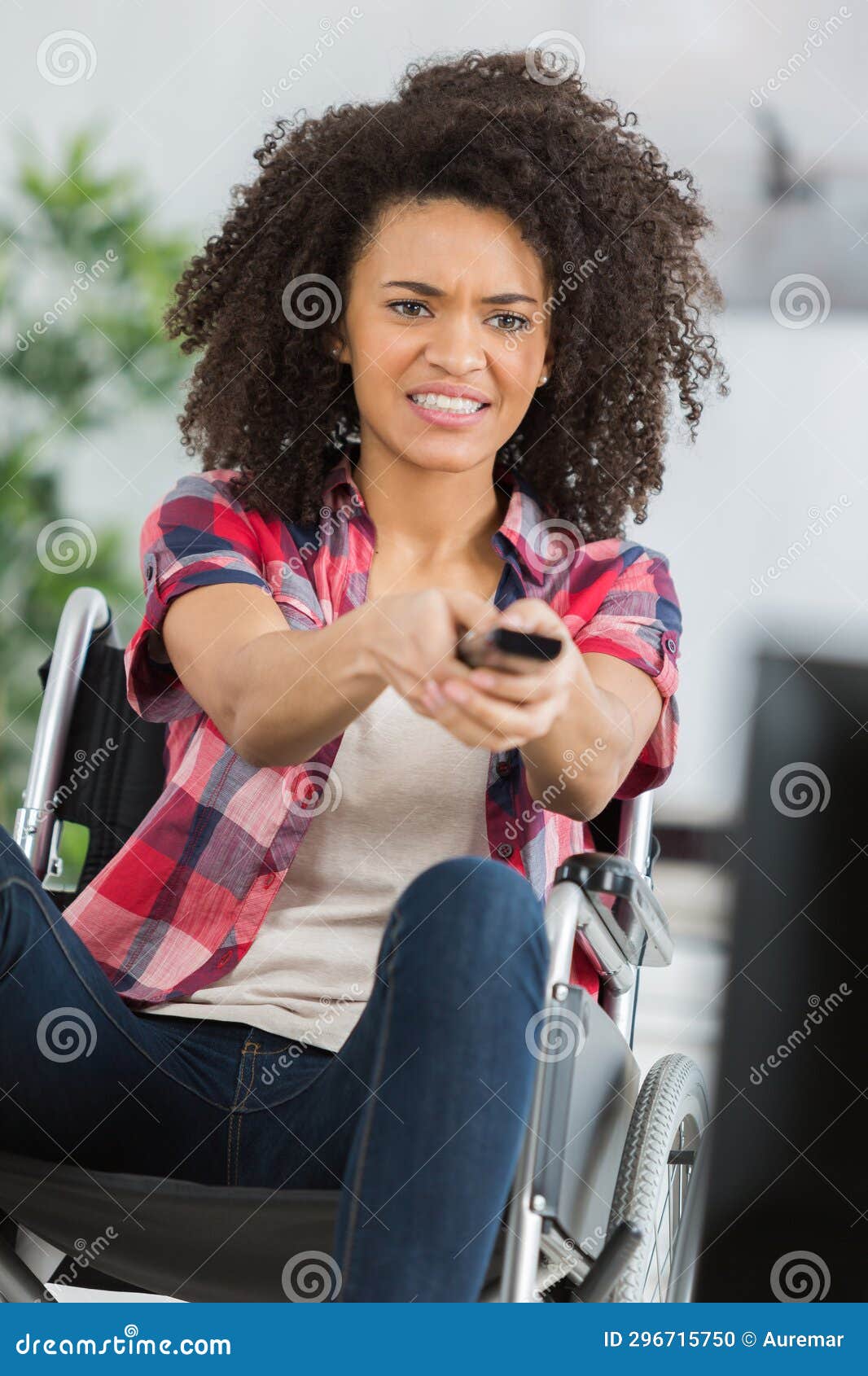 Lady in Wheelchair Having Difficulty with Remote Control Stock Photo ...