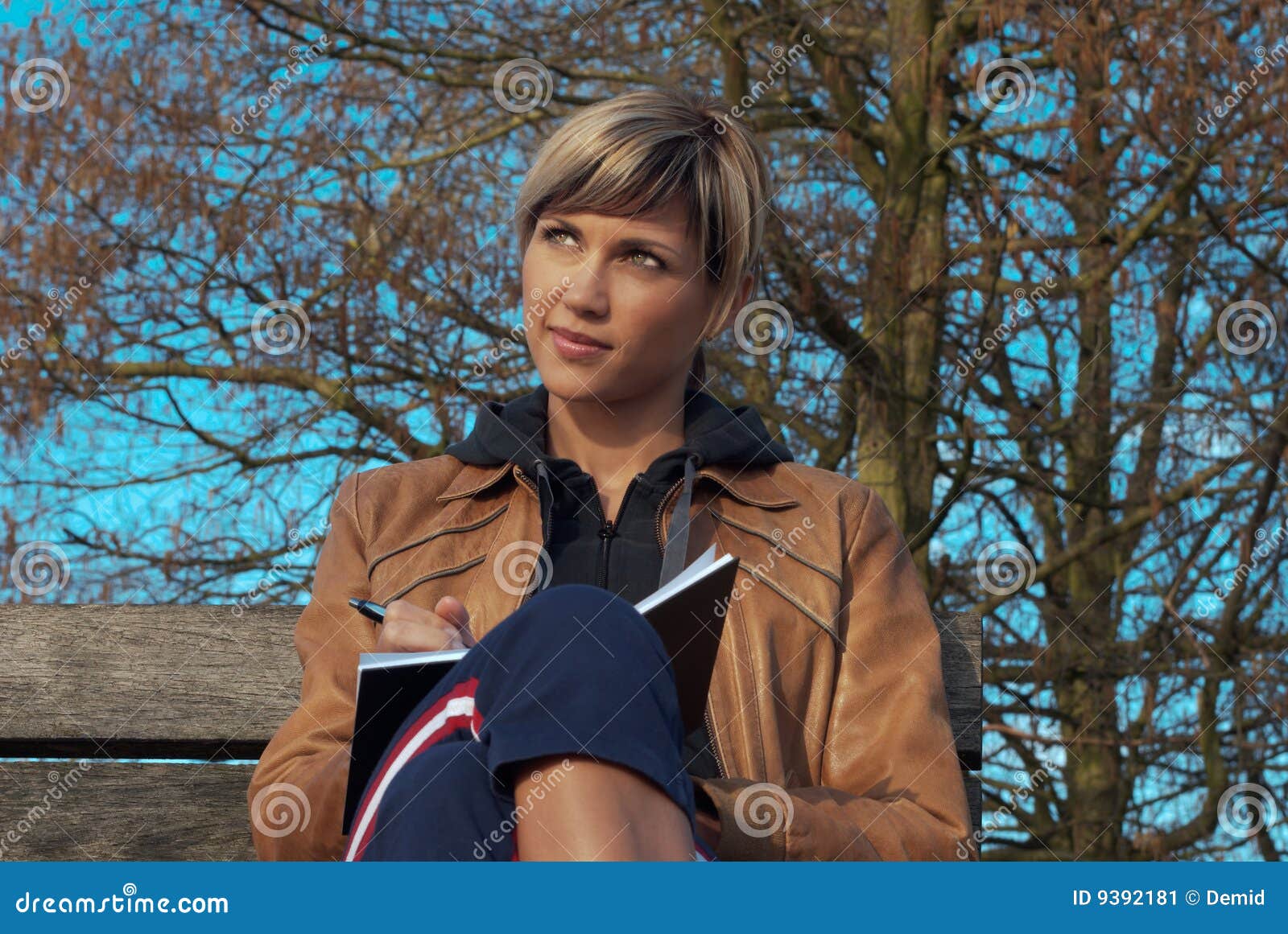 Lady Writing Outdoors stock image. Image of concentration - 9392181