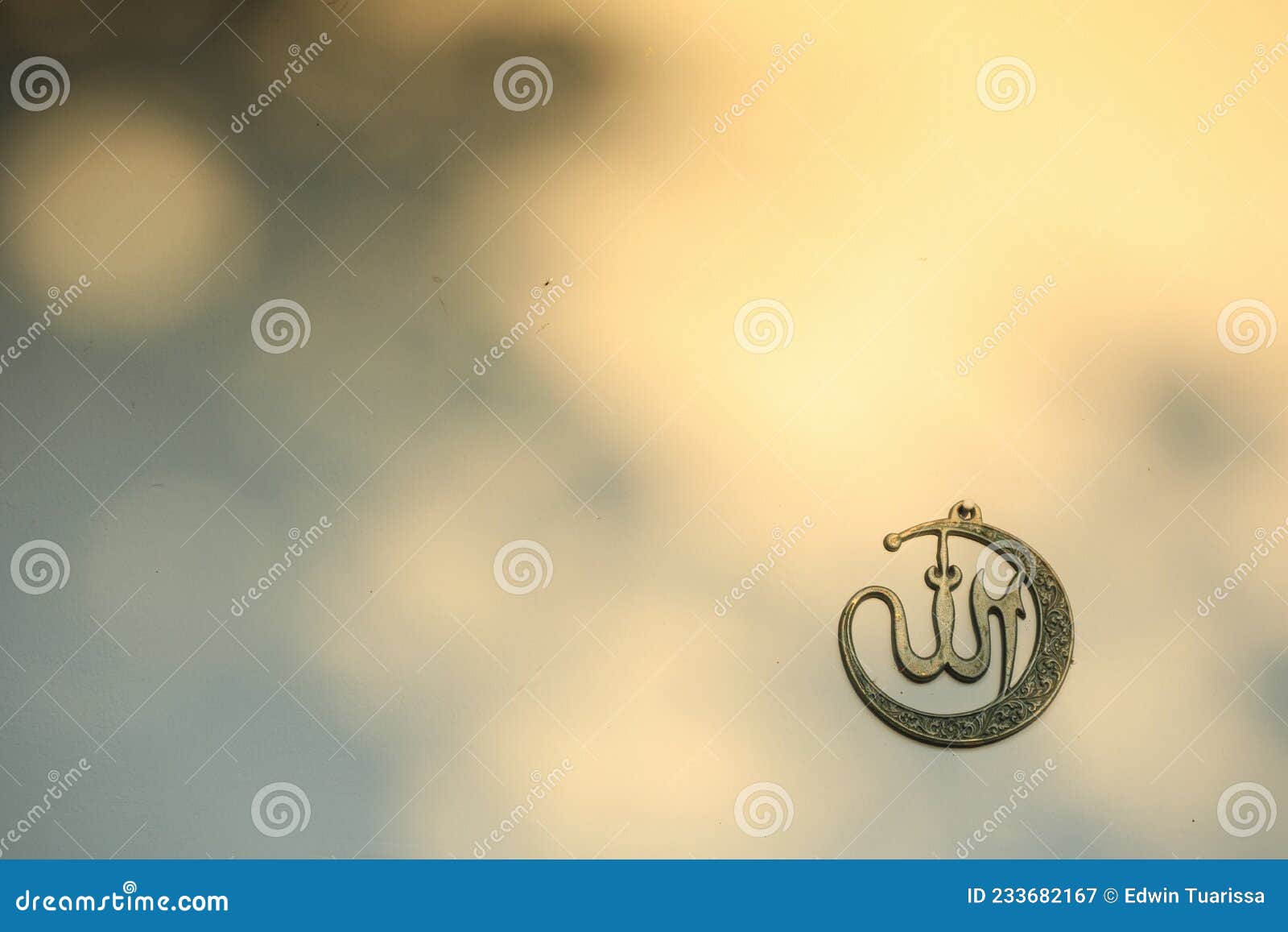 Lafadz Allah in Front of a Small Mosque that is Illuminated by the ...