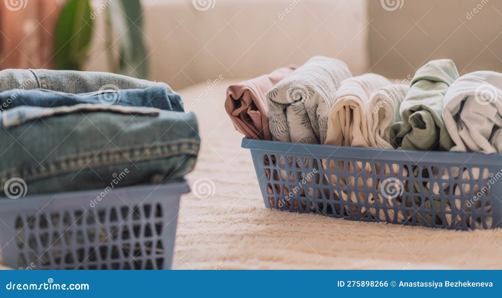 Laid Out Clothes in Blue Containers on the Bed Stock Photo - Image of ...
