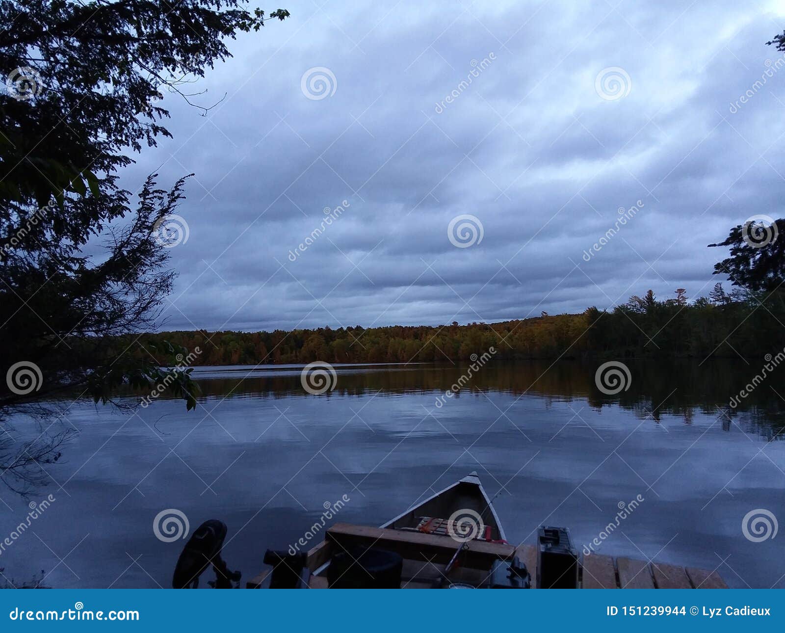 Lake Carmi Sunset stock photo. Image of trees, canoe - 151239944