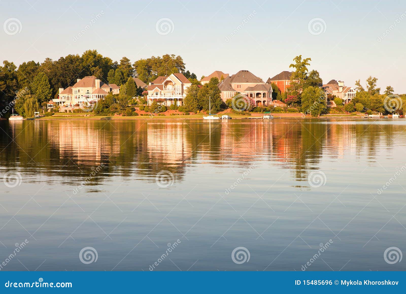 Lake and house on sunset stock photo. Image of scenic - 15485696