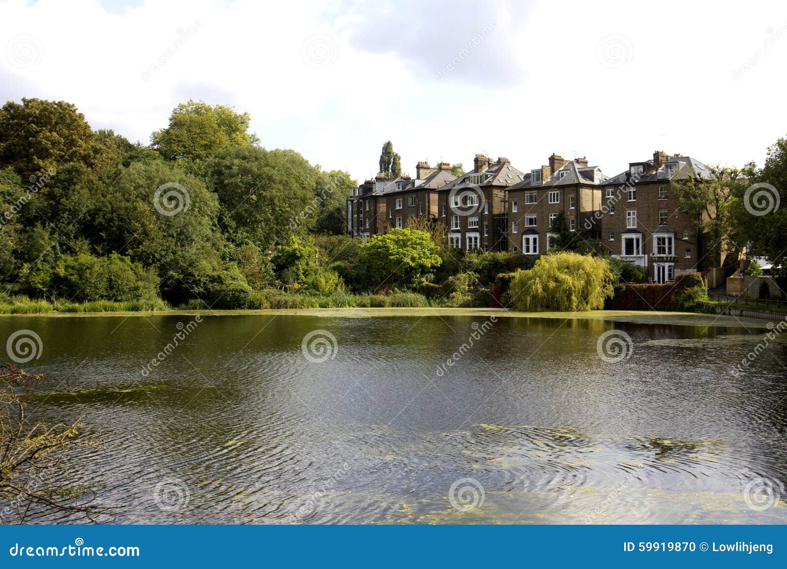 Lake and houses stock photo. Image of natural, huts, cloudy - 59919870