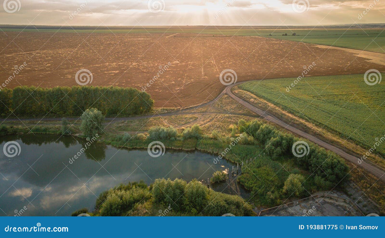 The Lake in the Middle of Endless Green Fields Stock Image - Image of ...