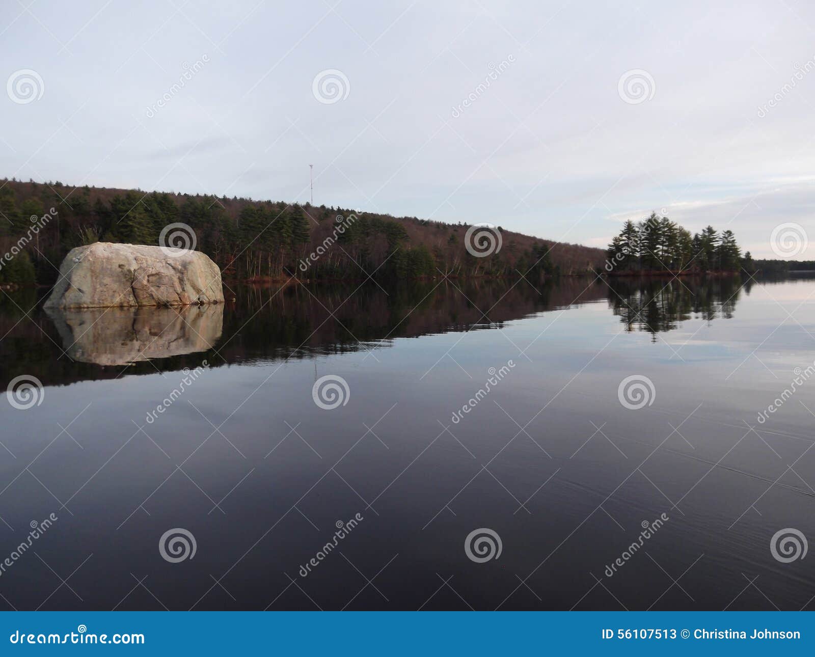 Lake Reflections of Rock & Tree Stock Image - Image of distant, trees ...