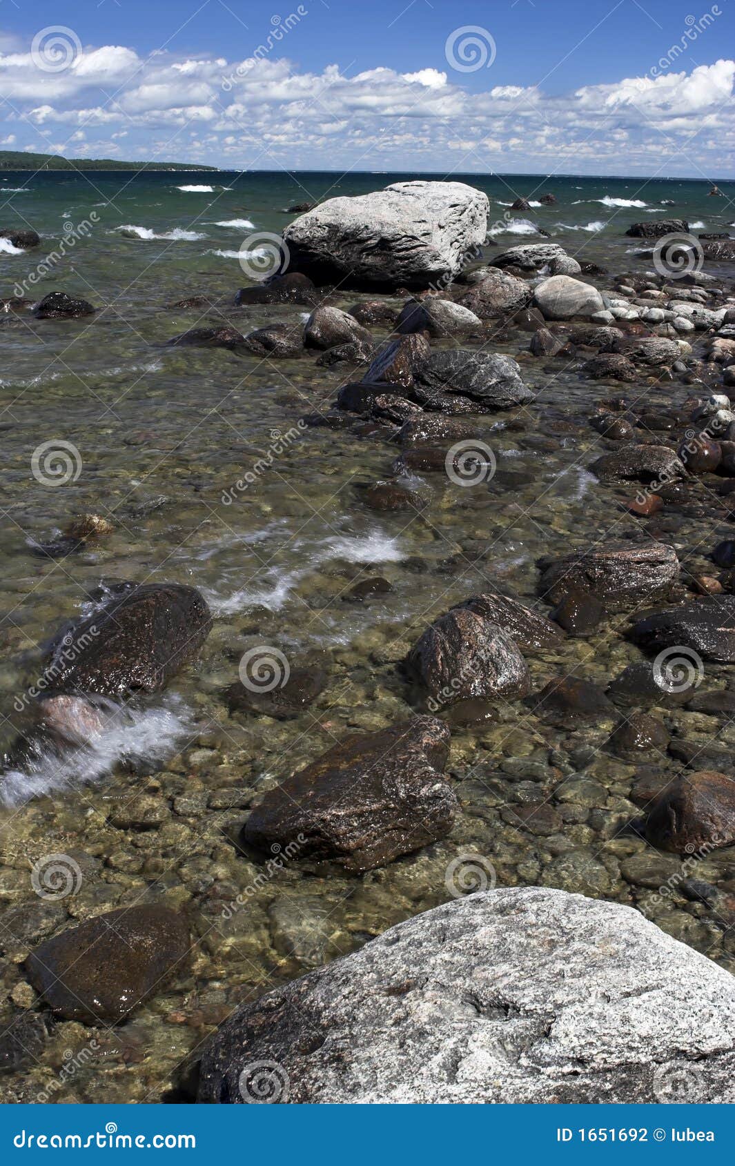 Lake shore with stones stock photo. Image of shore, michigan - 1651692