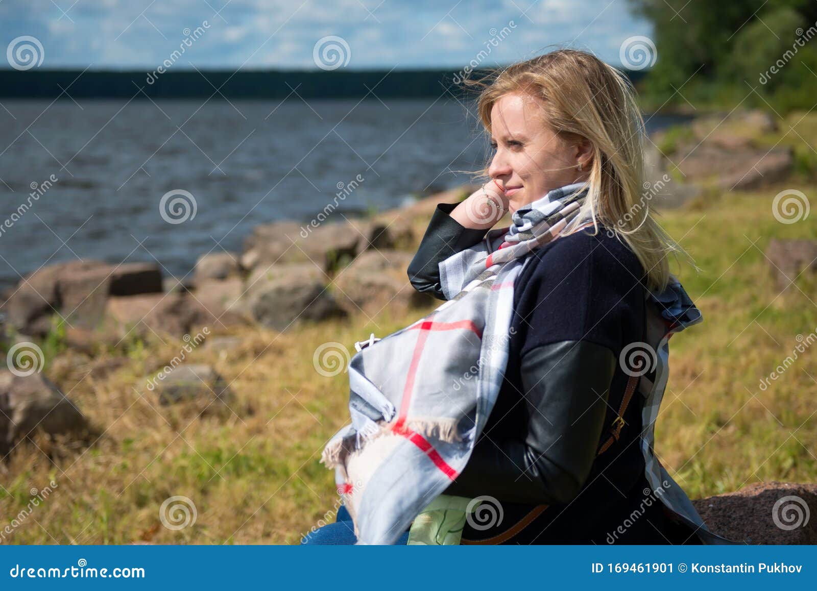 On a lake in a strong wind stock image. Image of girl - 169461901