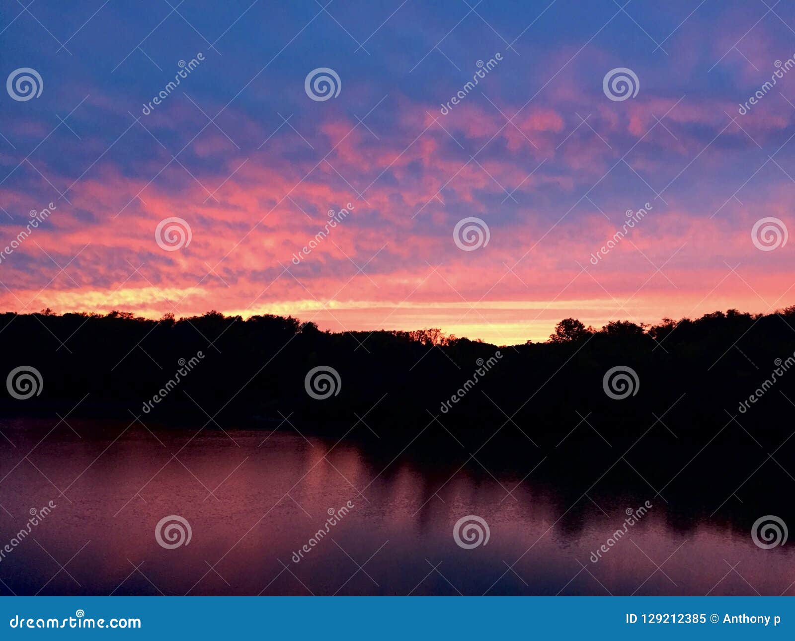 Lake sunset stock image. Image of trees, pond, cloud - 129212385