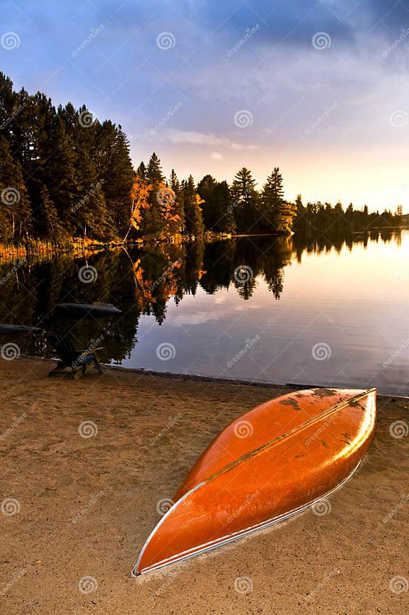 Lake Sunset with Canoe on Beach Stock Photo - Image of lake, park: 12569100