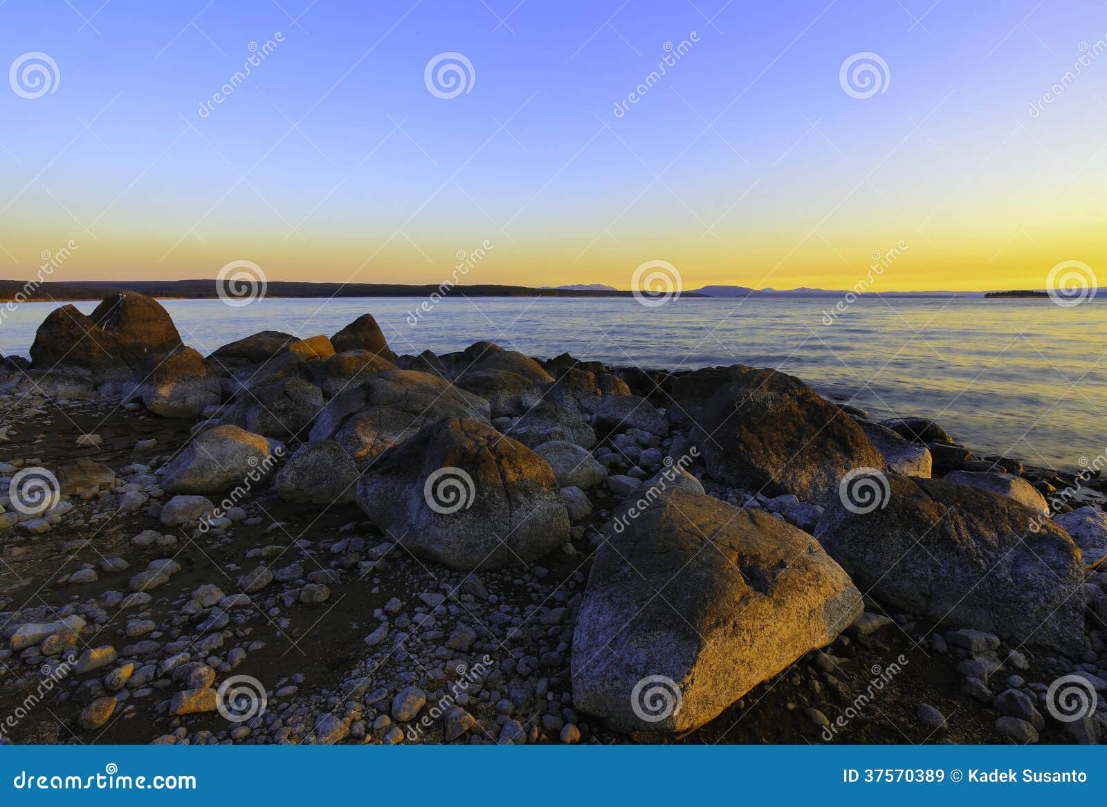 Lake sunset and rocks stock image. Image of haze, light - 37570389