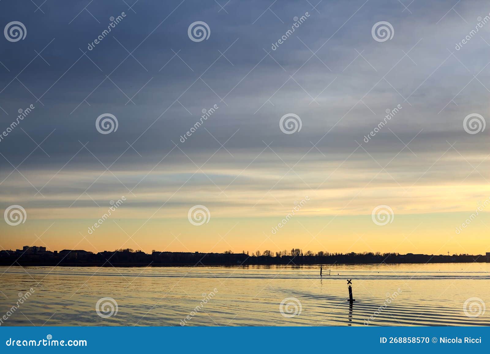 Lake at Sunset with the Sky Casted in the Water Seen from the Shore ...