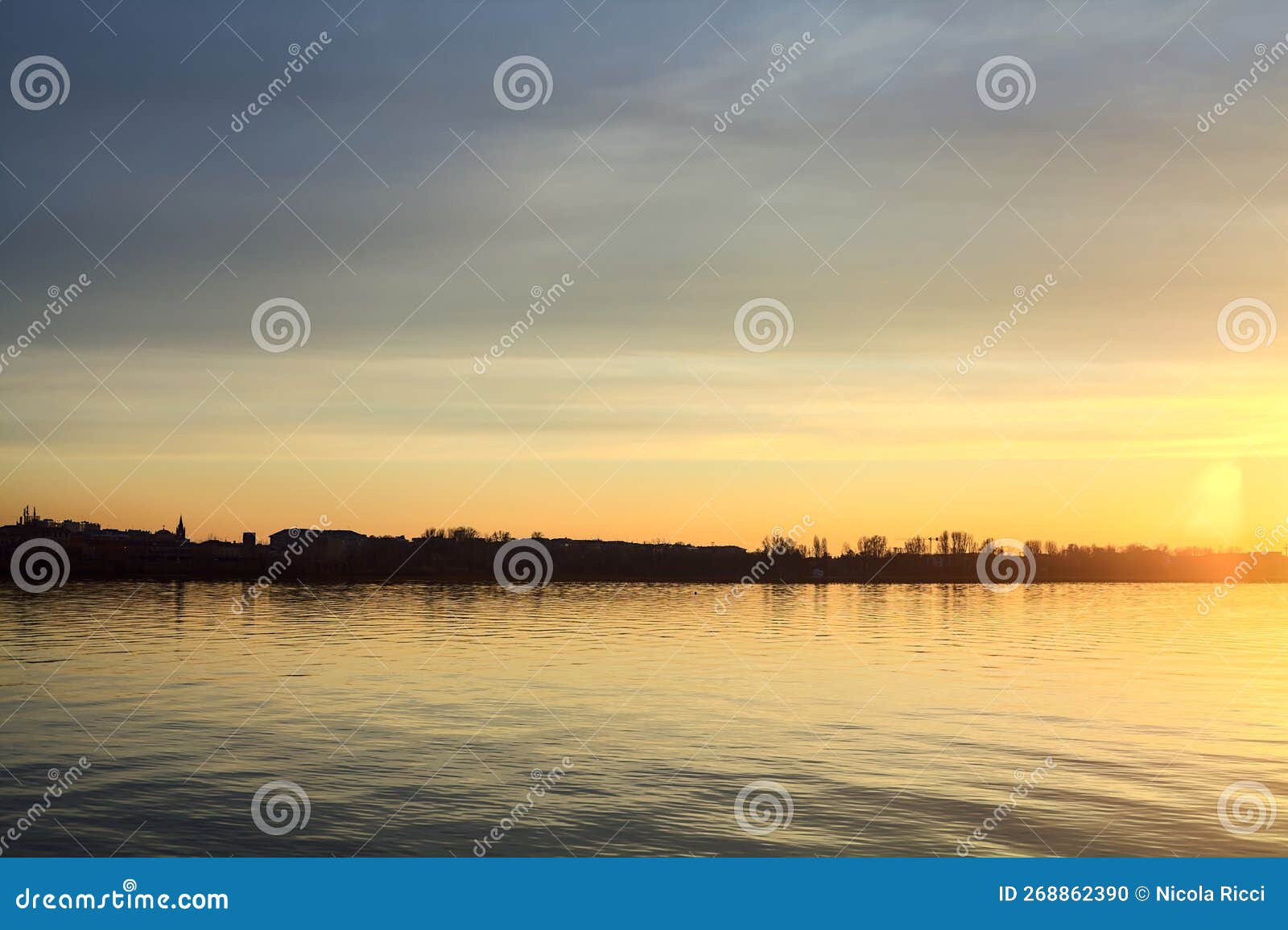 Lake at Sunset with the Sky Casted in the Water Seen from the Shore ...