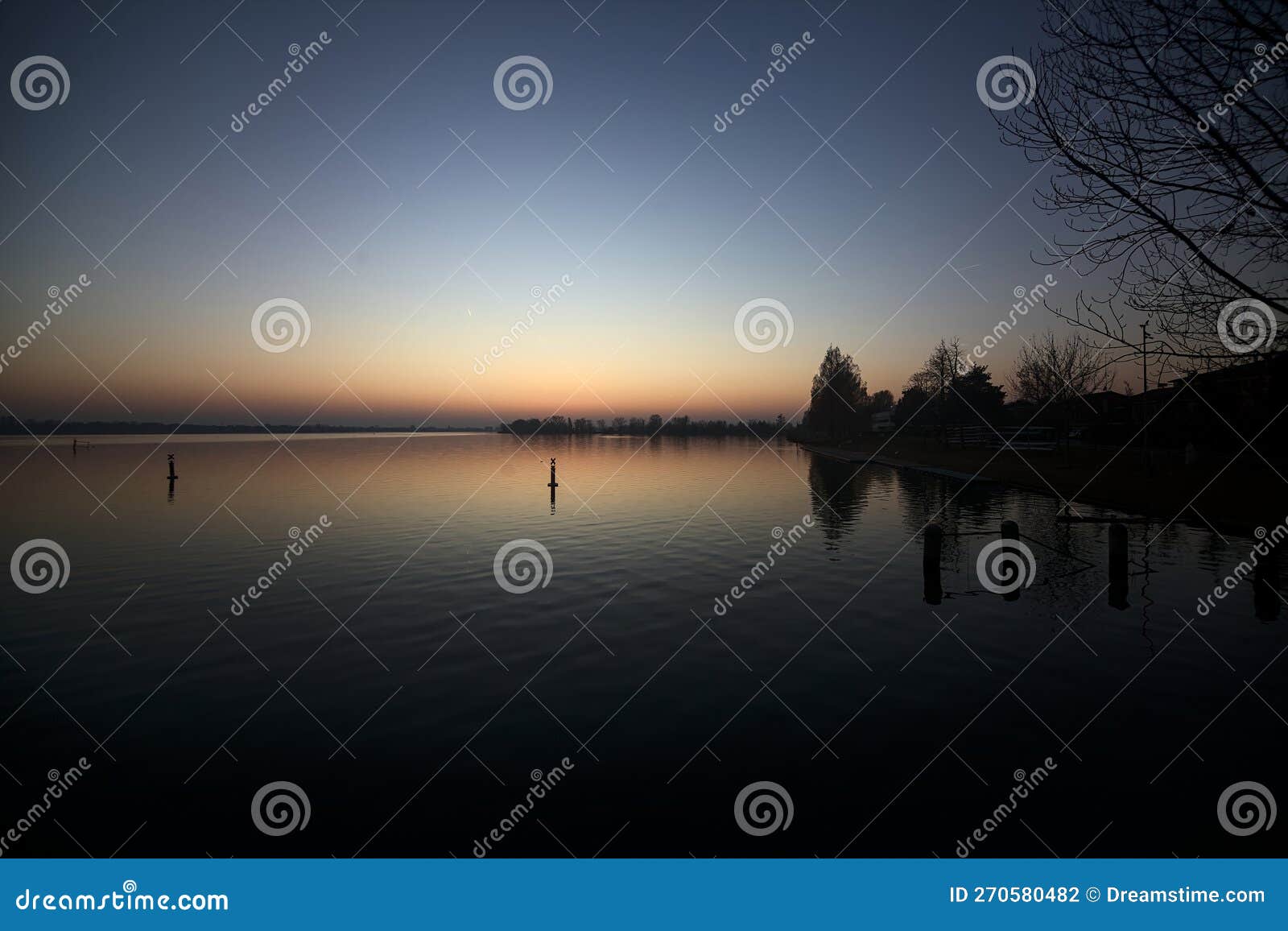 Lake at Sunset with Trees and the Sky Casted in the Water Stock Photo ...