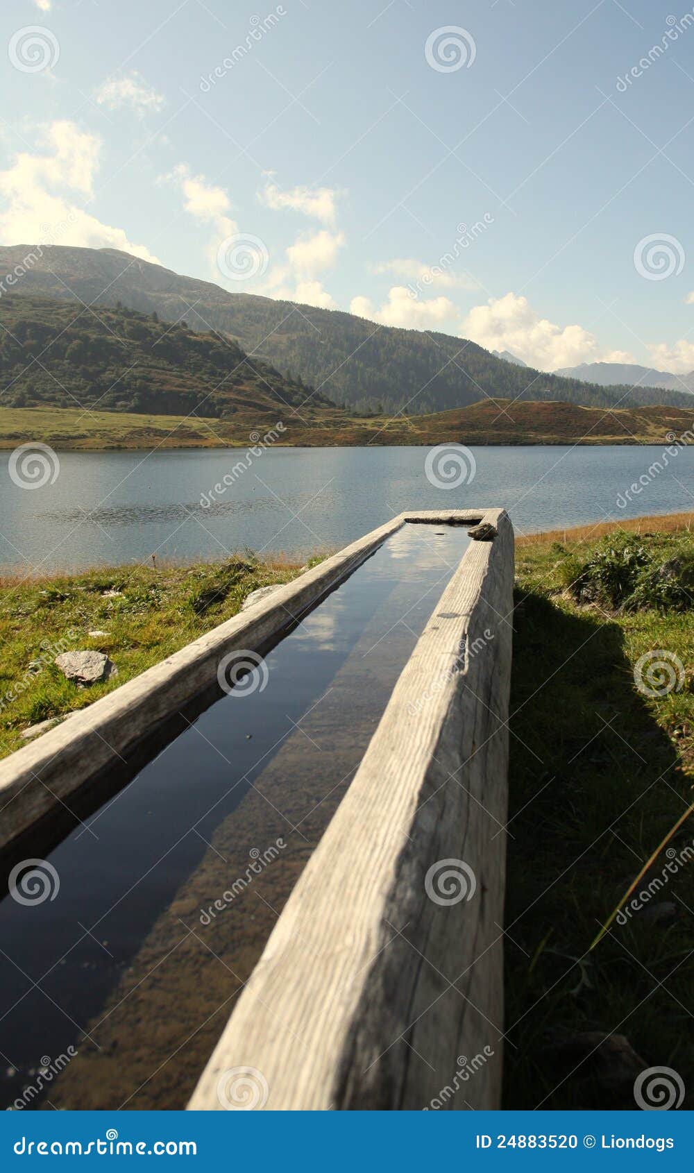 Lake in Swiss Alps with Water Pipe in Front Stock Photo - Image of ...
