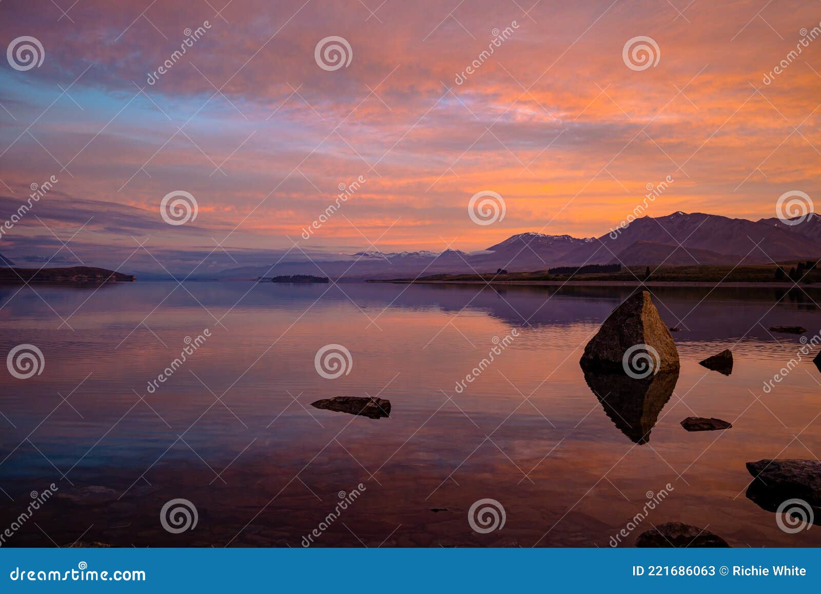 Lake Tekapo in the Glow of the Spring Sunrise Stock Image - Image of ...