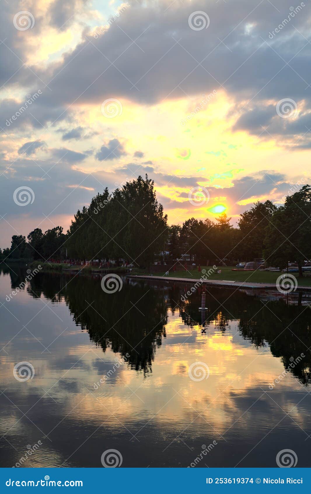 Lakeshore with a Resort and Mooring at Sunset Stock Photo - Image of ...