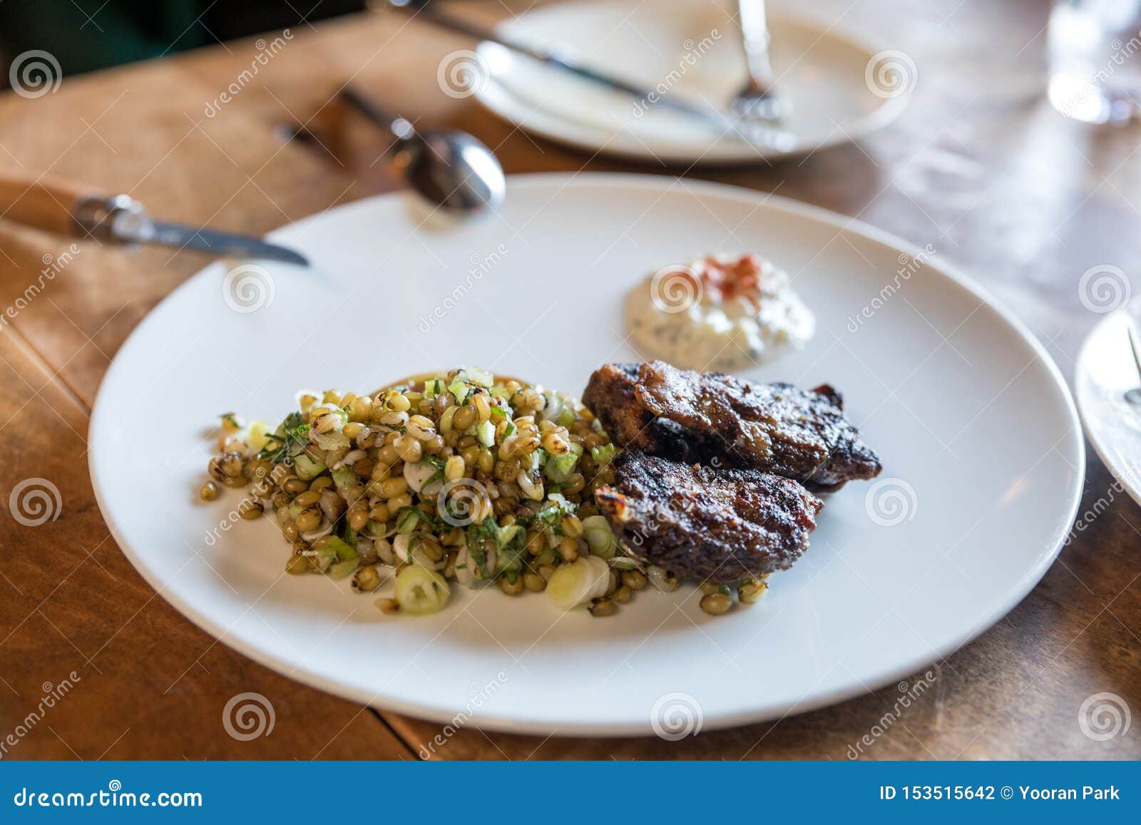 Lamb cheeks with couscous stock photo. Image of plate - 153515642