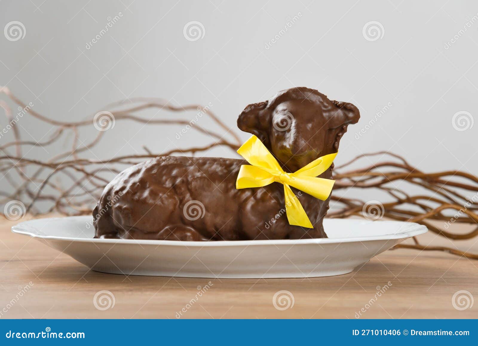 Lamb Shaped Chocolate with Yellow Bow and Easter Decorations Stock ...