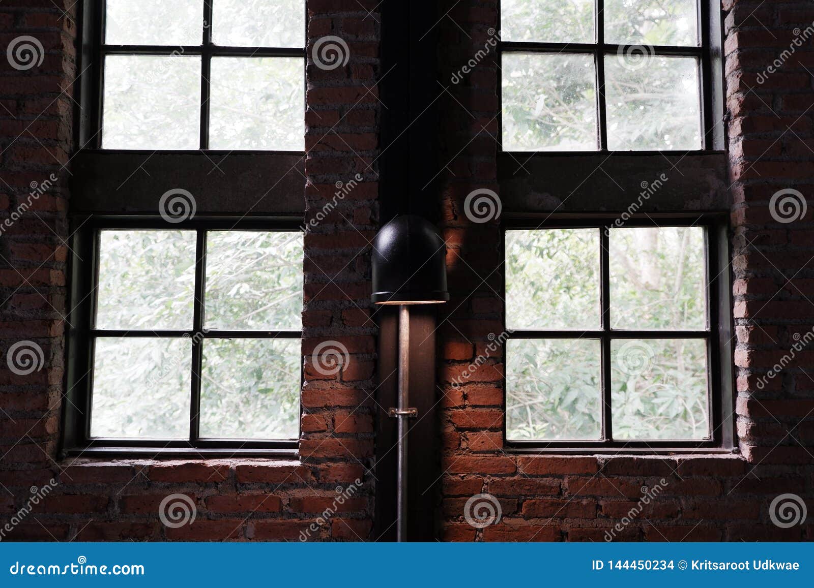 Lamp on Brick Wall and Near Windows. Loft Style Stock Photo - Image of ...