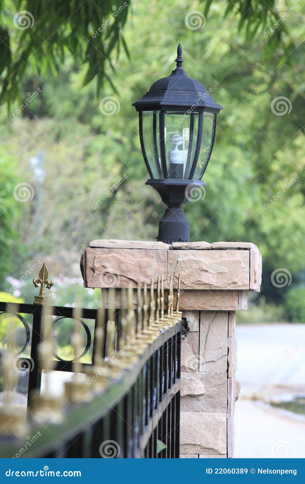 Lamp on fence wall stock image. Image of lamp, energy - 22060389