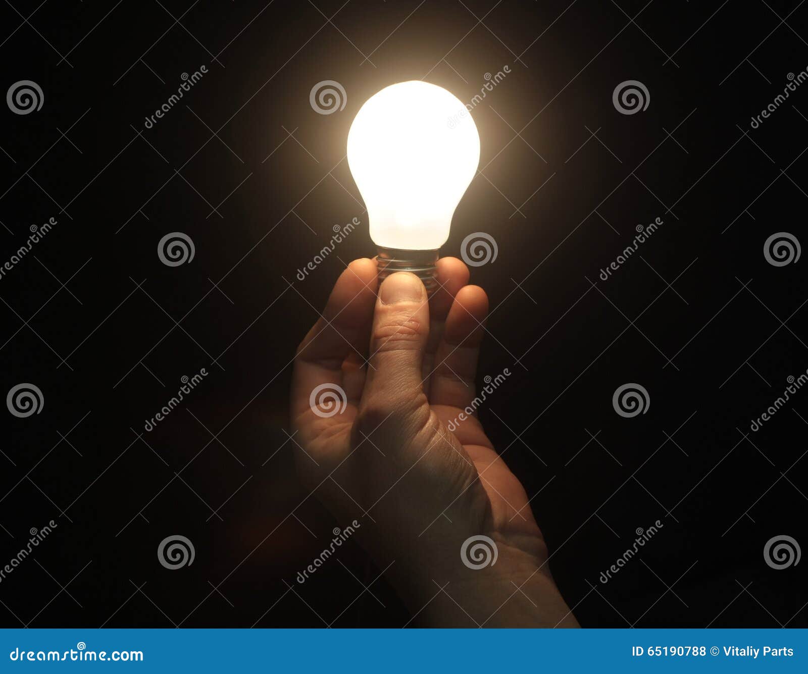 Lamp in hand stock photo. Image of closeup, electric - 65190788